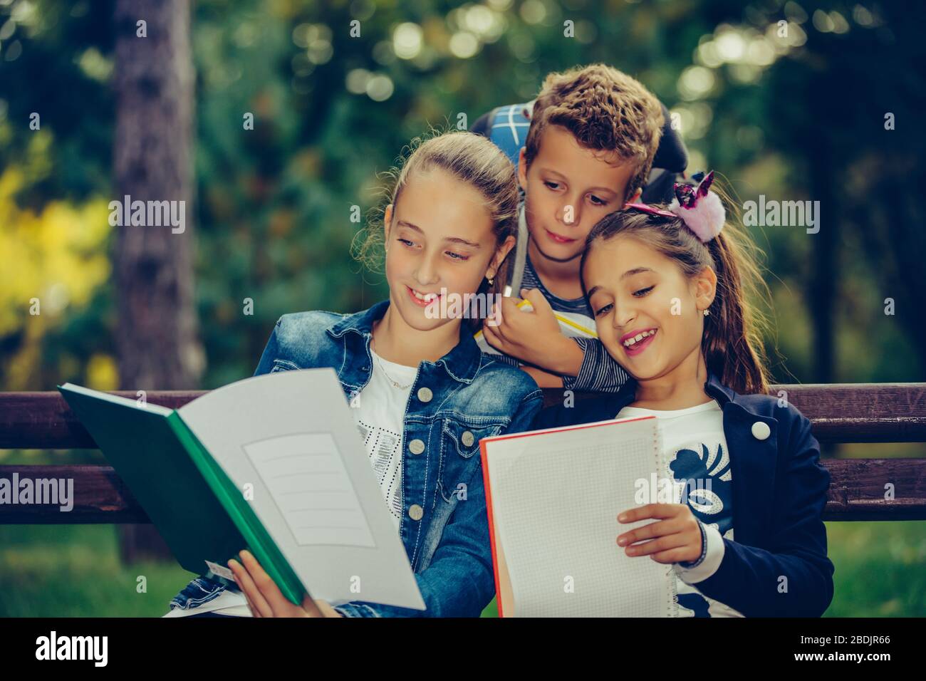 Back to school. Children with backpacks are having fun, talking ...