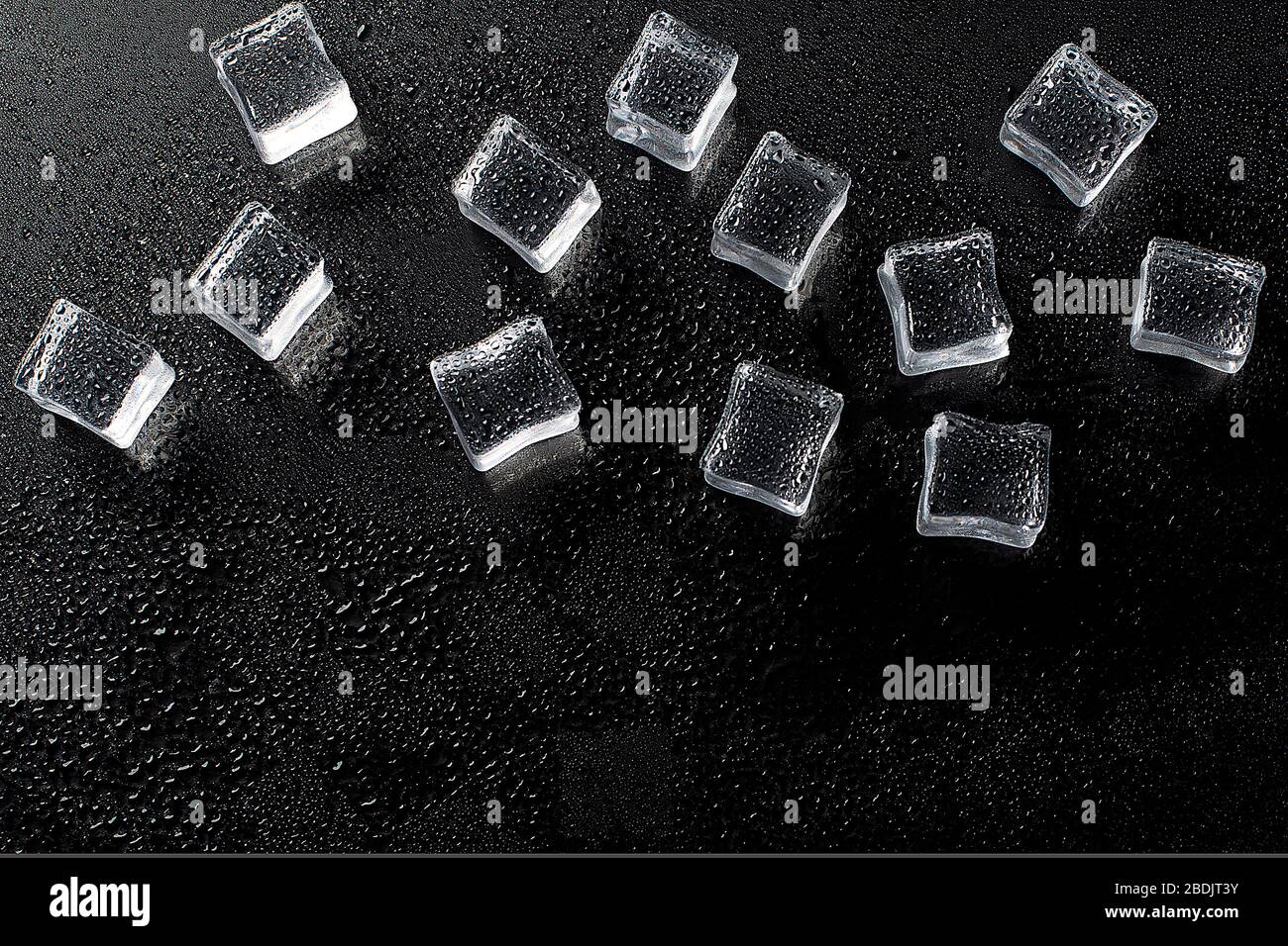 Fresh ice cubes and reflections on black background Stock Photo - Alamy