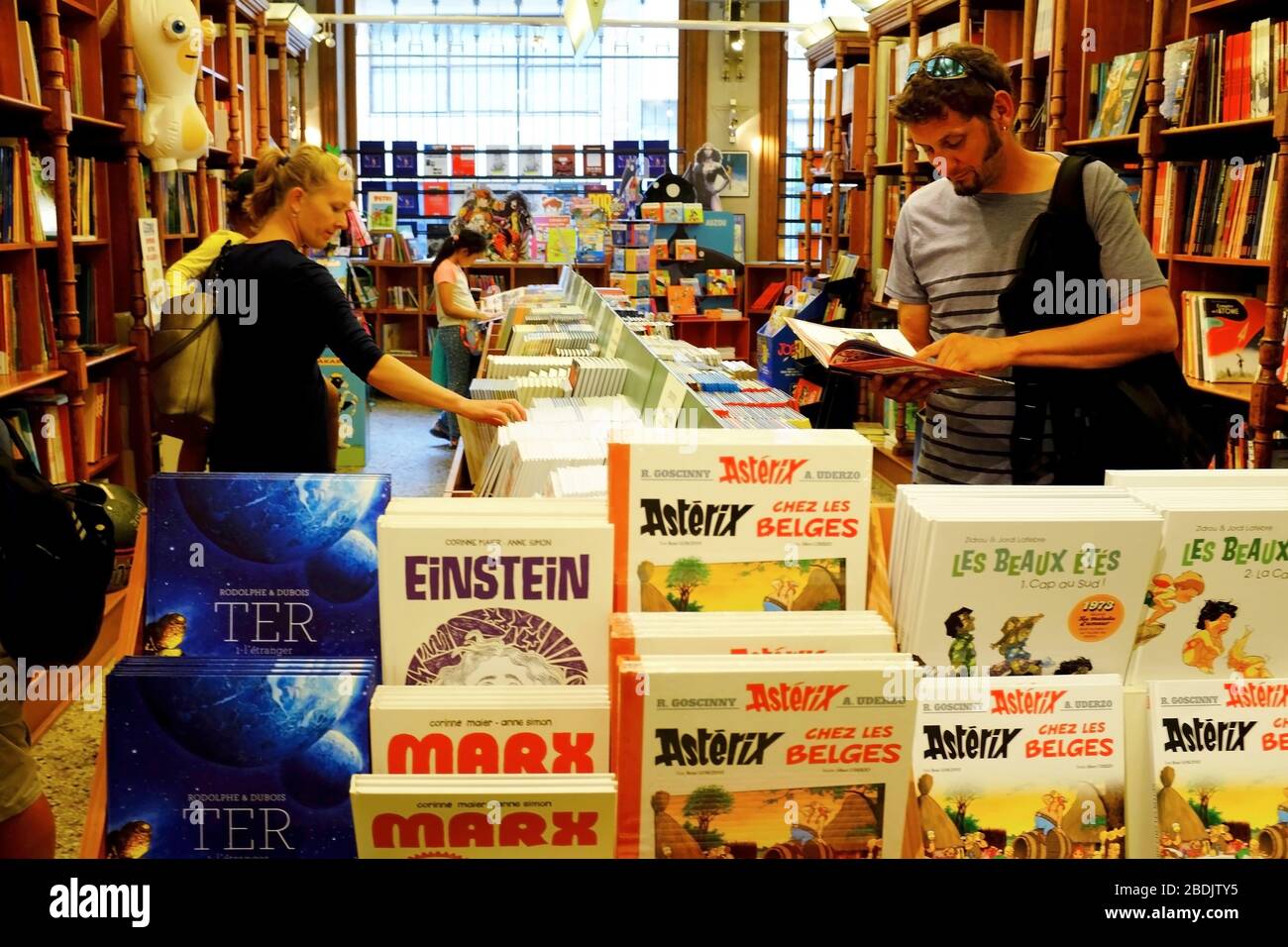 Customers in the gift shop book store of Belgian Comic Strip Center ...