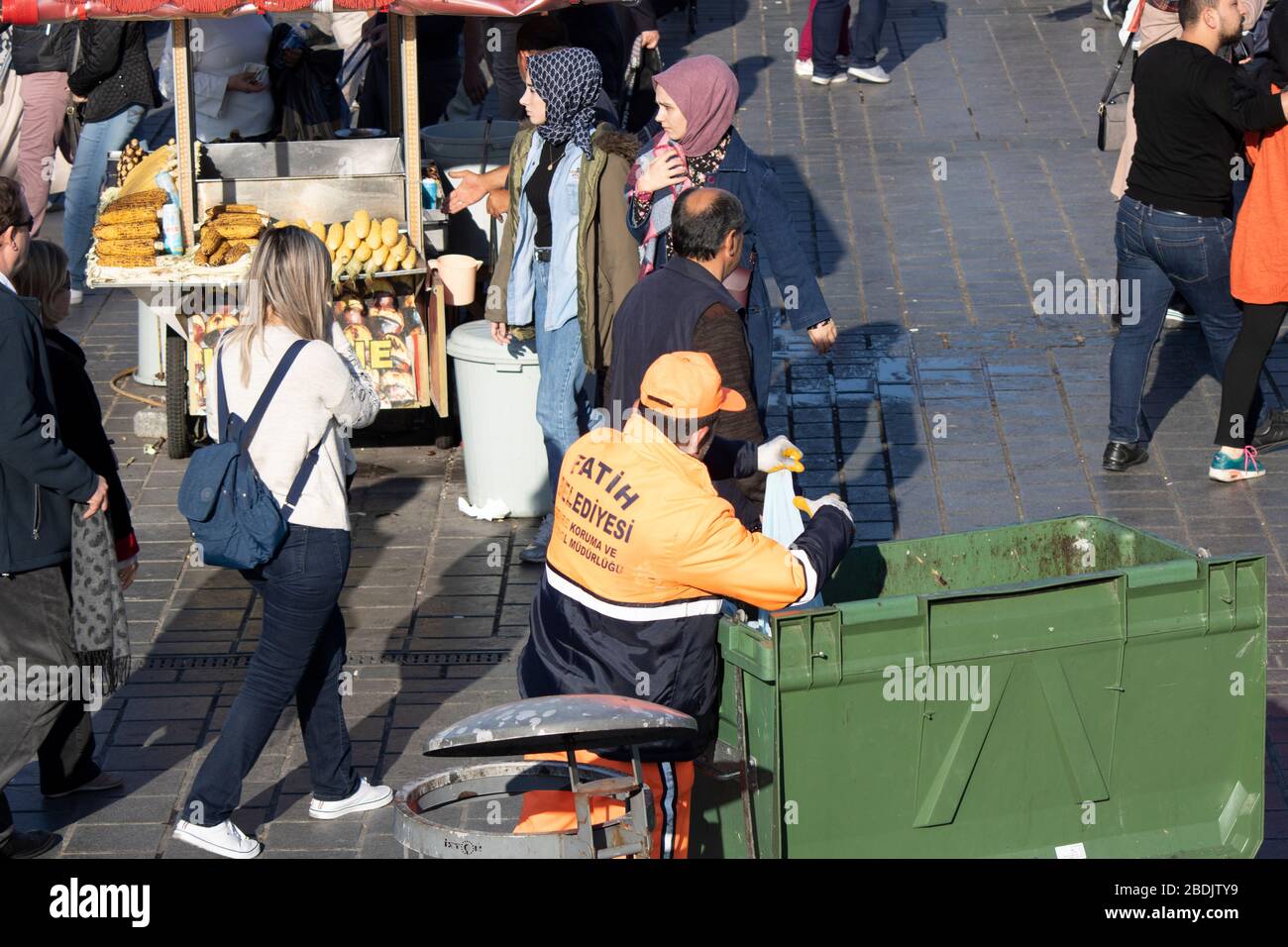 Traffic lights and people crossing the pedestrian path. A municipal ...