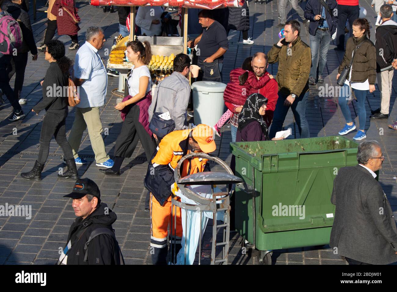 Traffic lights and people crossing the pedestrian path. A municipal ...