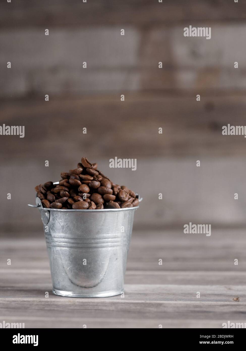 Bucket and scoop of coffee beans on burlap sack Stock Photo - Alamy