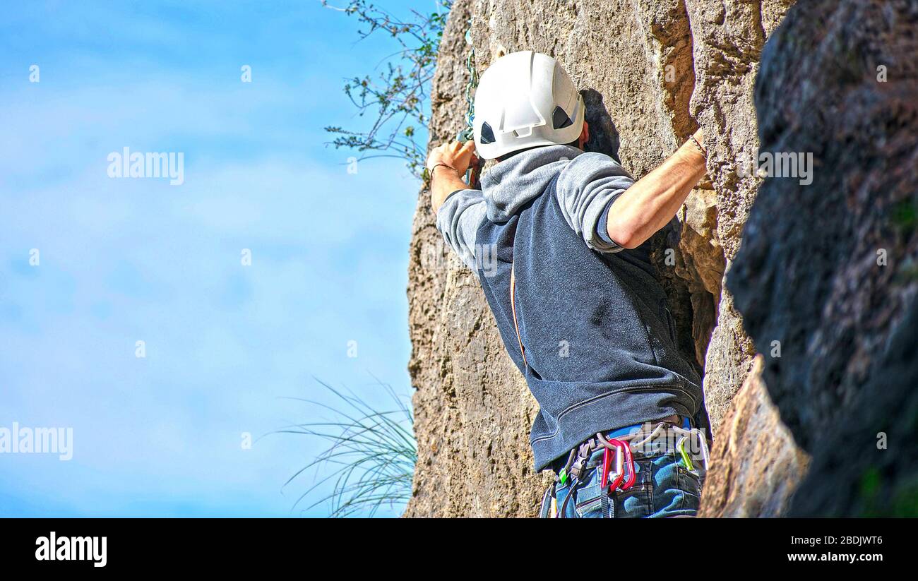 One sportsman mountain climbing. Physical activity in the countryside ...