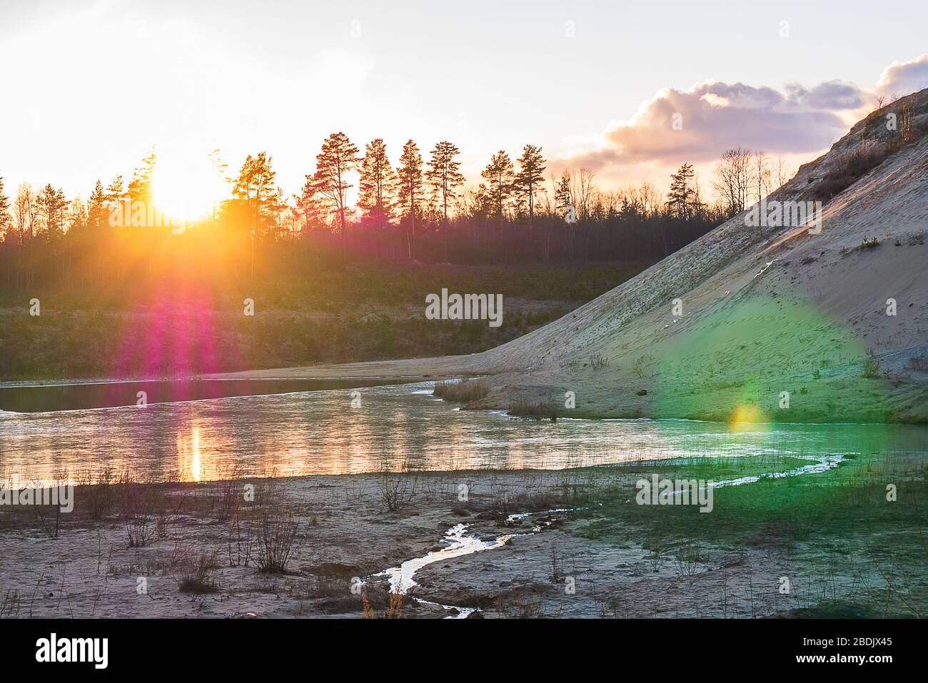 Sunset in the background of an abandoned quarry Stock Photo - Alamy