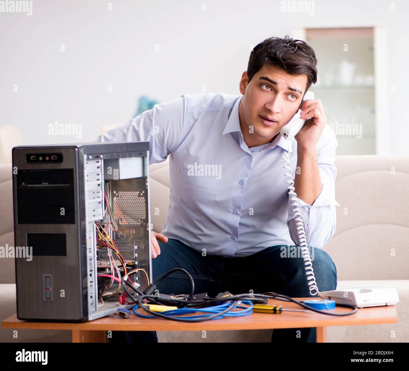 The angry customer trying to repair computer with phone support Stock ...