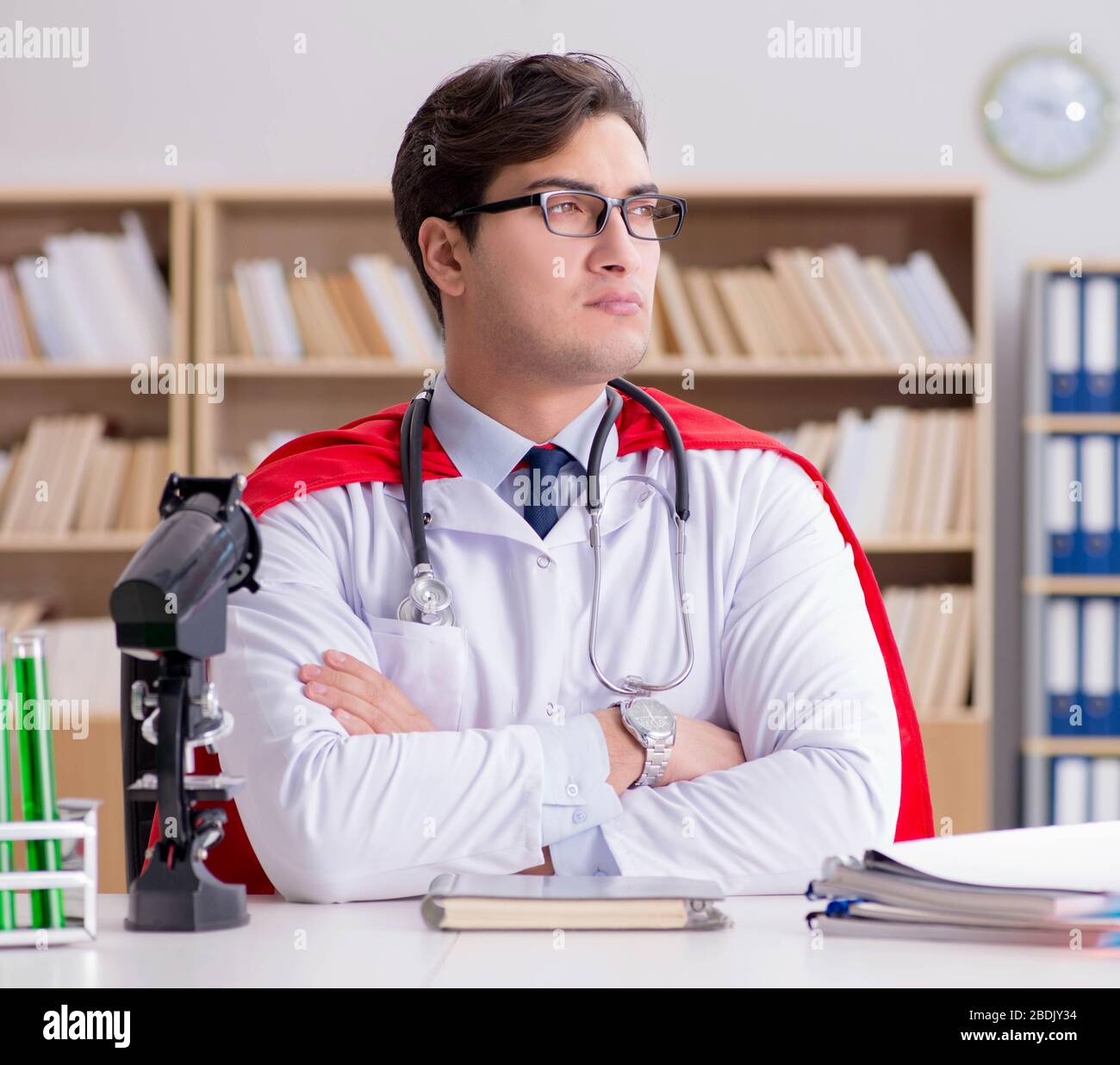The superhero doctor working in the lab hospital Stock Photo - Alamy
