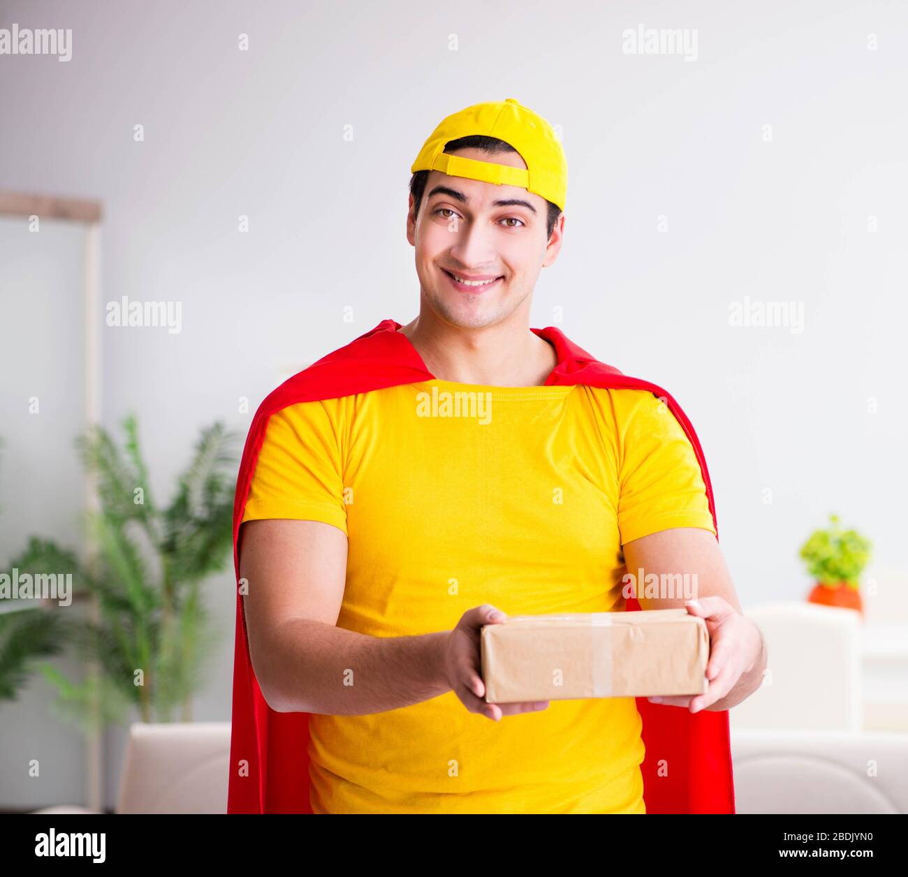 The superhero delivery guy with box Stock Photo - Alamy