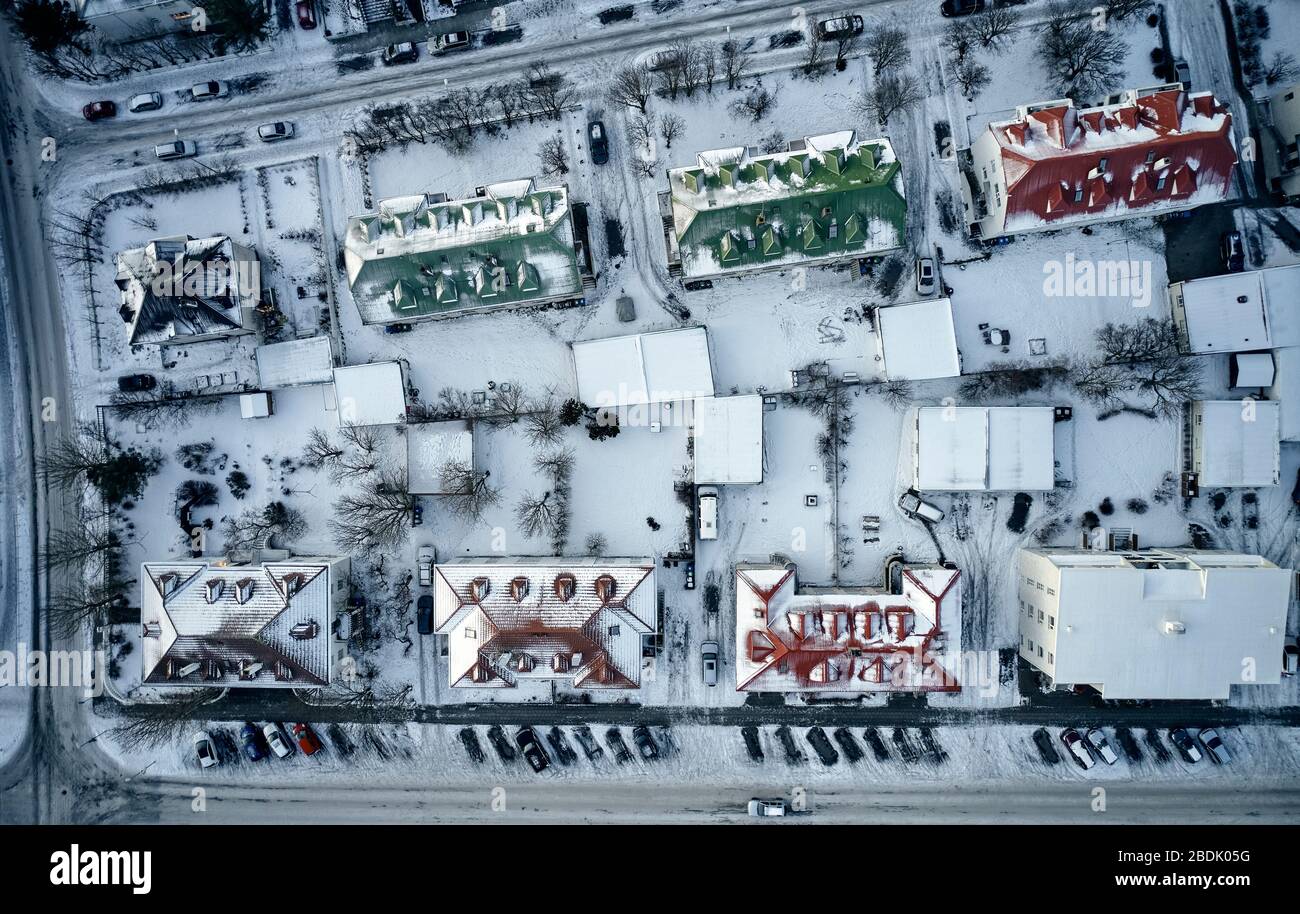 Aerial from above view of rooftops of low rise buildings covered with ...