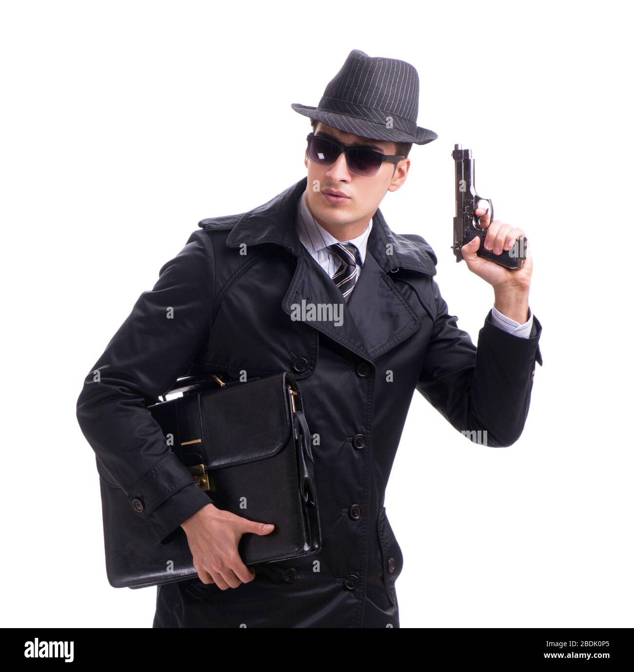 The man spy with handgun isolated on white background Stock Photo - Alamy