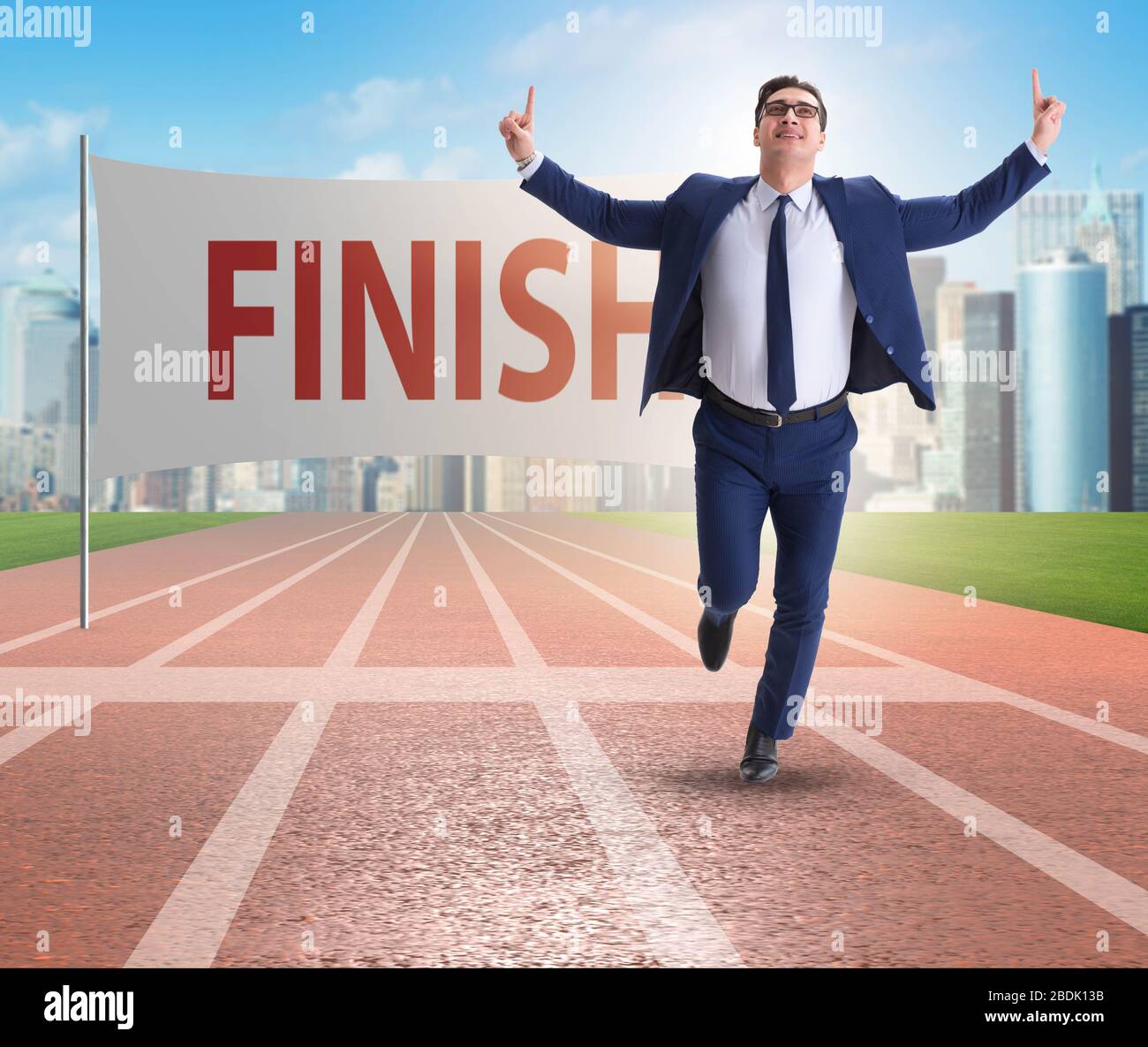 The businessman on the finishing line in competition concept Stock ...