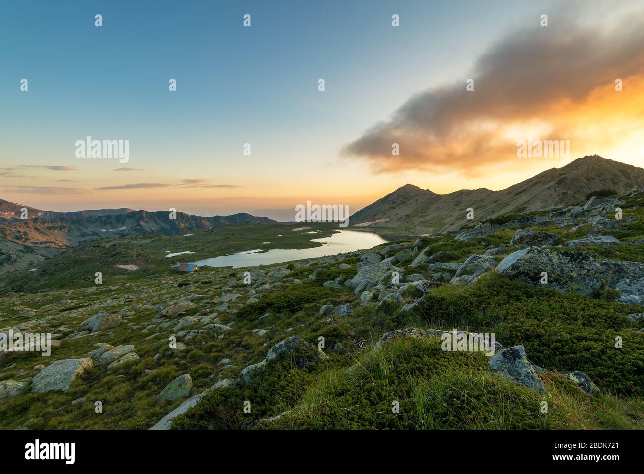 Sunset landscape with Kamenitsa peak and Tevno lake, Pirin Mountain ...