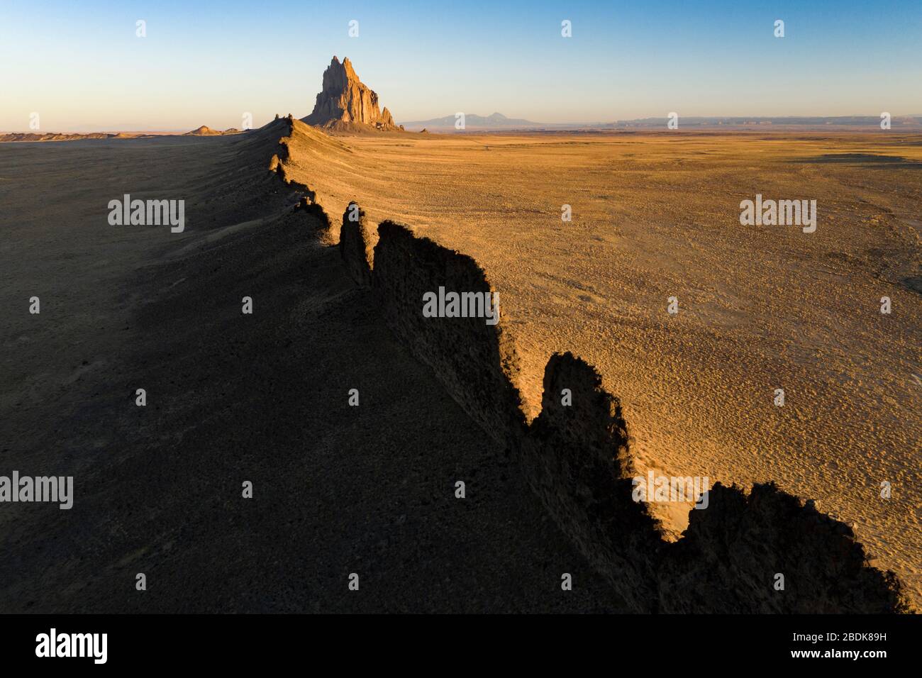 Aerial with leading line of lava towards Shiprock in New Mexico Stock ...