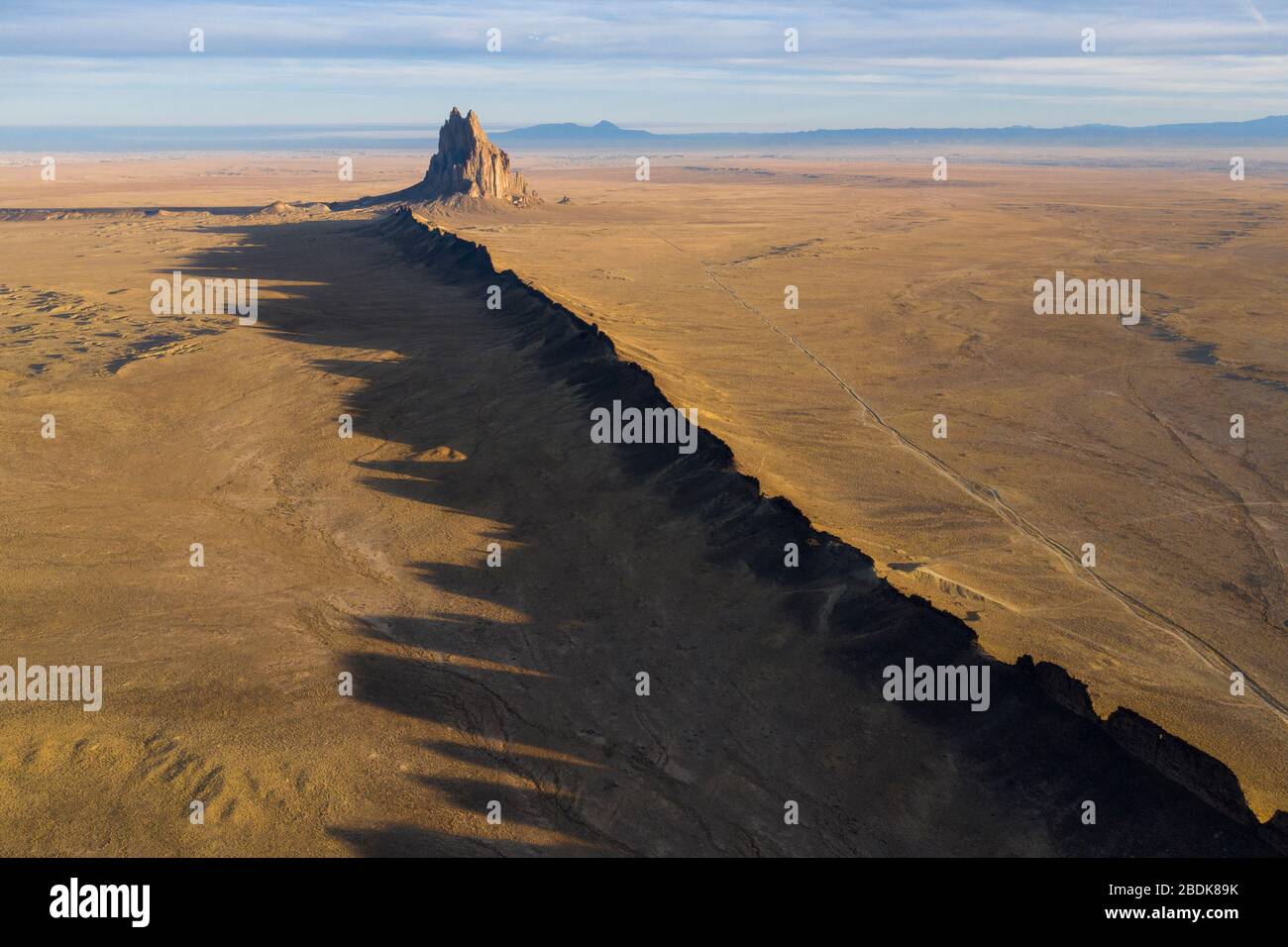 Aerial with leading line of lava towards Shiprock in New Mexico Stock ...