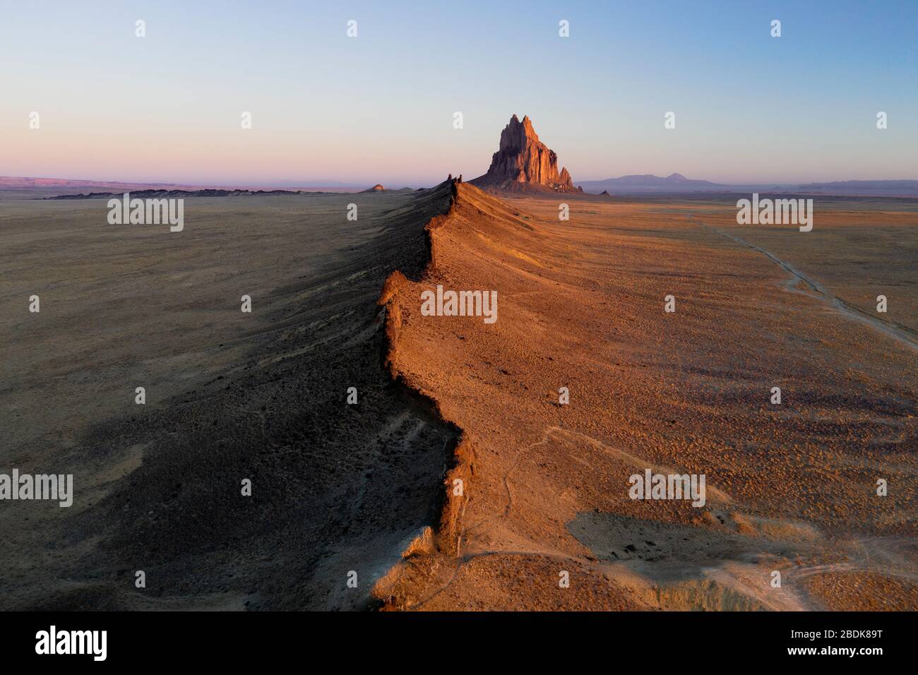 Aerial with leading line of lava towards Shiprock in New Mexico Stock ...