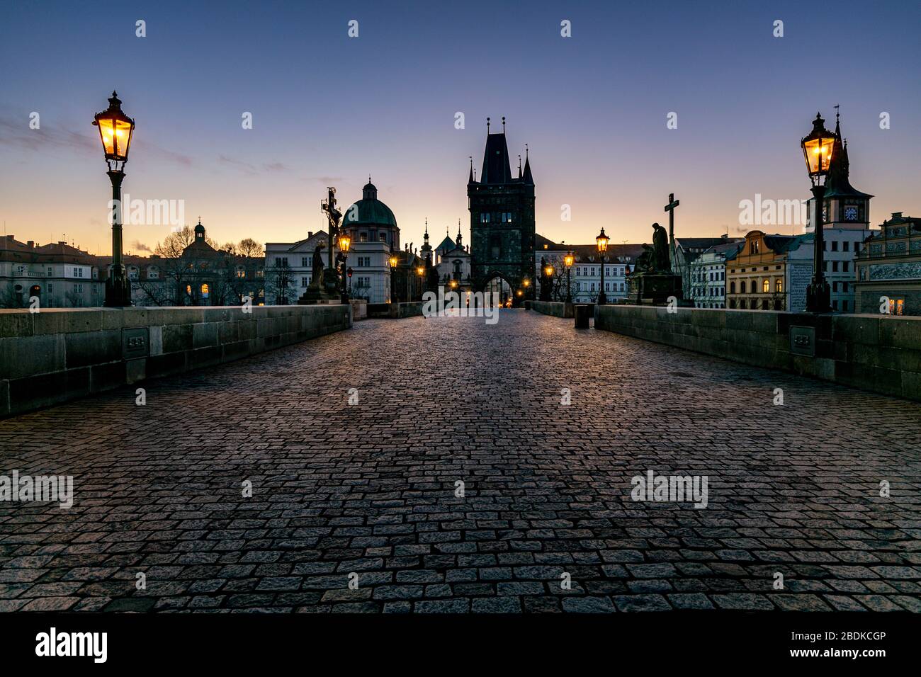 Charles Bridge at dawn with the towers and spires of the Old Town beyond, Prague, Czech Republic ...