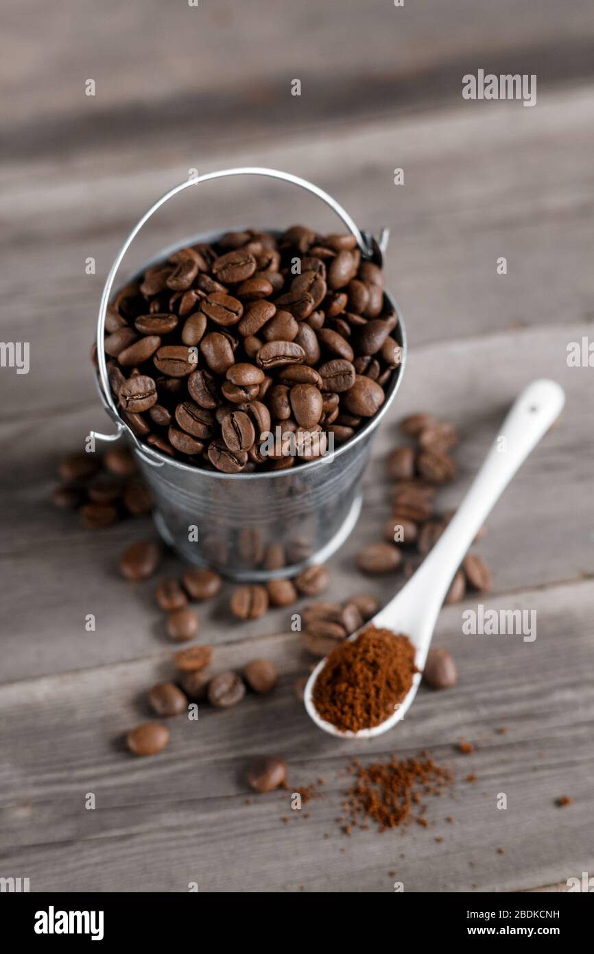 Arabica coffee beans in a small miniature bucket. ground coffee in a ...