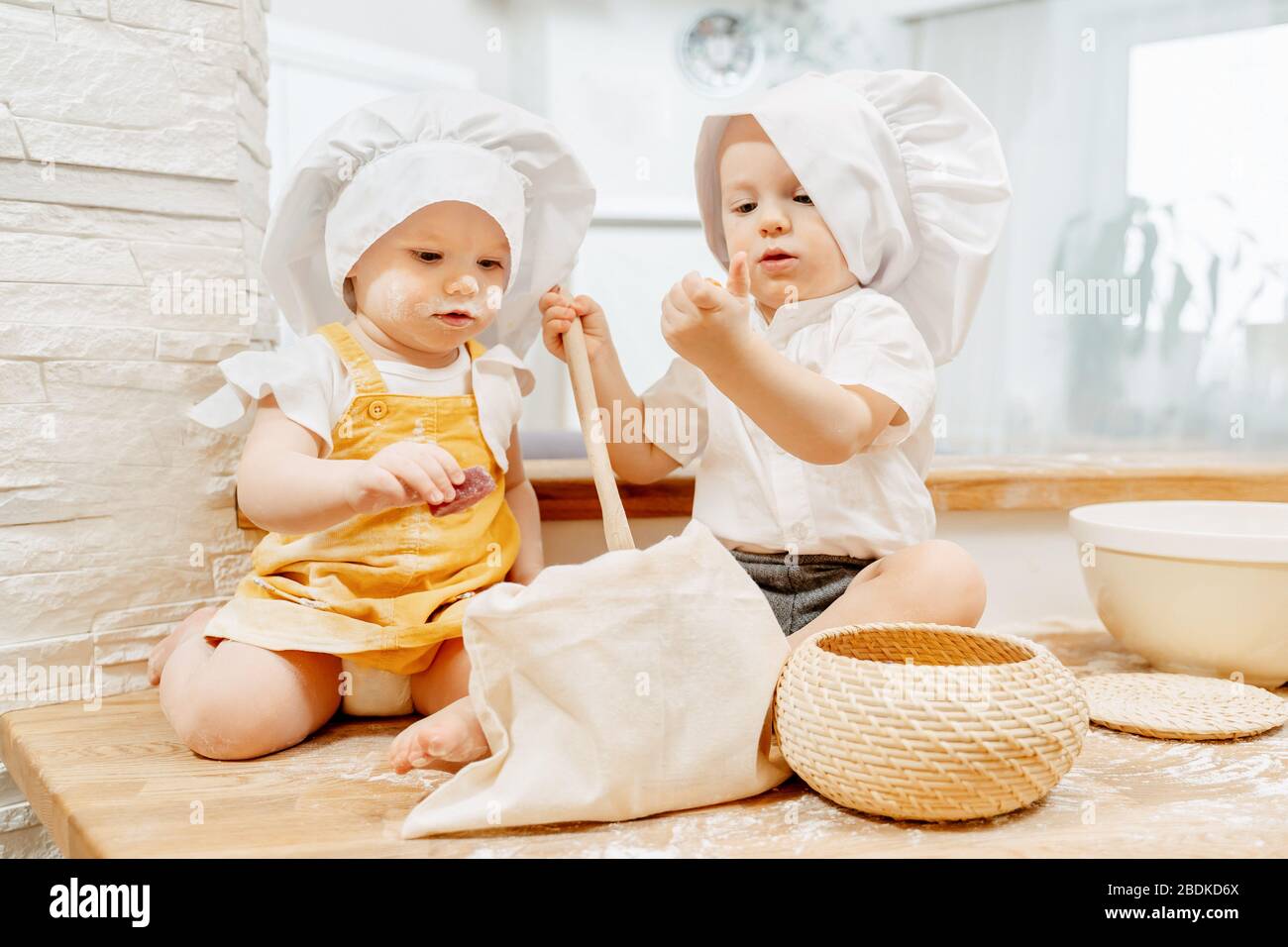 Curious little charming cook children in hats Stock Photo - Alamy