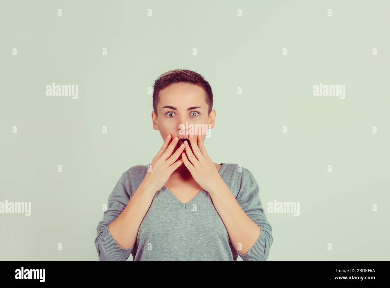 Amazed Shocked Woman Looking At Camera Hands On Open Mouth Isolated