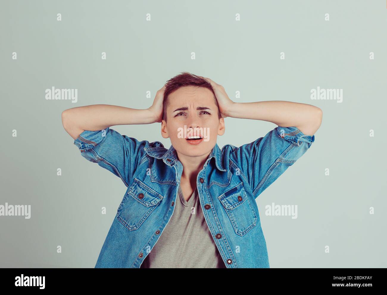 Stress. Woman stressed overwhelmed is going crazy hands on head looking ...