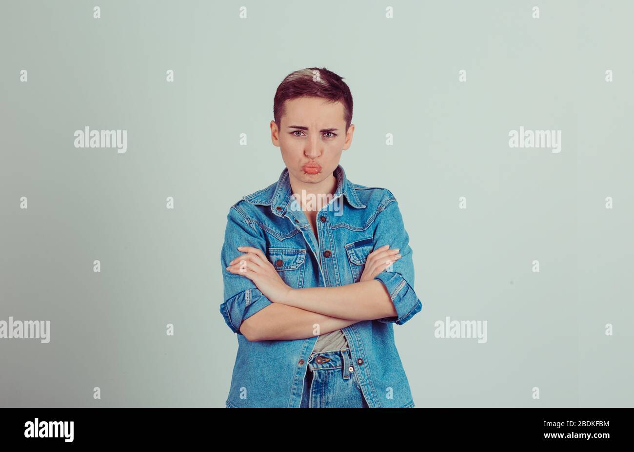 Offended sad grumpy Young Woman Over White background, half body. Body ...