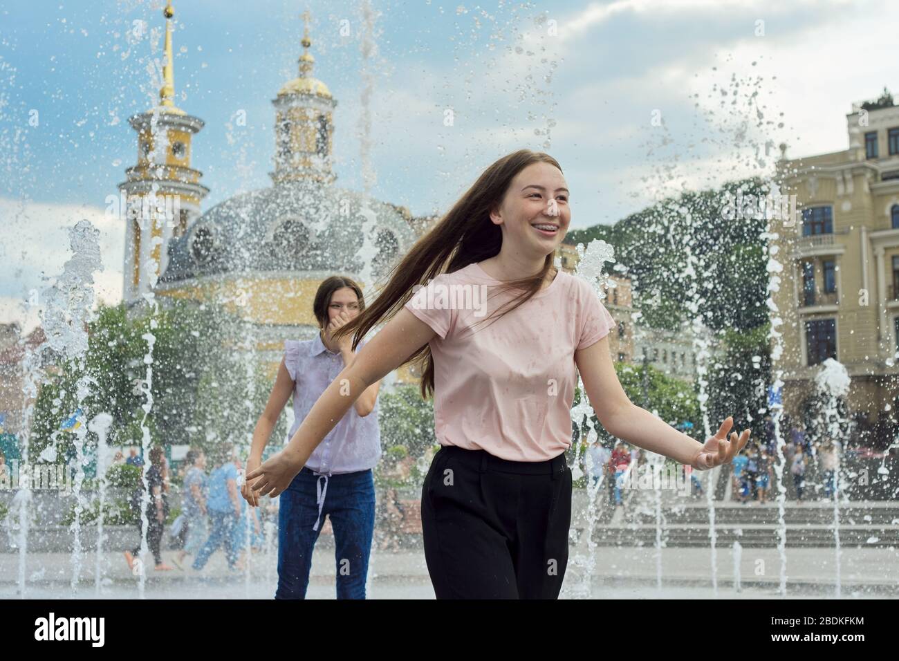 Teenage girls, people having fun in the city fountain Stock Photo - Alamy