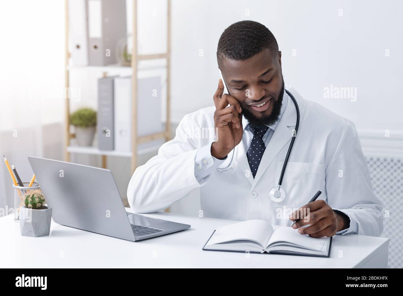 Doctor calling phone hi-res stock photography and images - Alamy