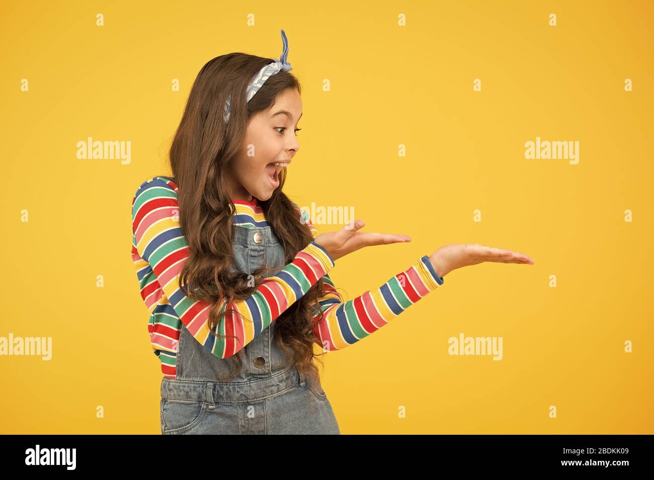 Girl demonstrate product. Promoting product for kids. Launching product ...