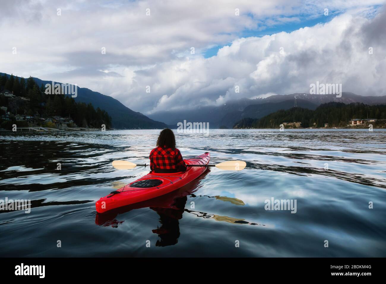 Adventurous Girl Paddling on a Bright Red Kayak Stock Photo - Alamy
