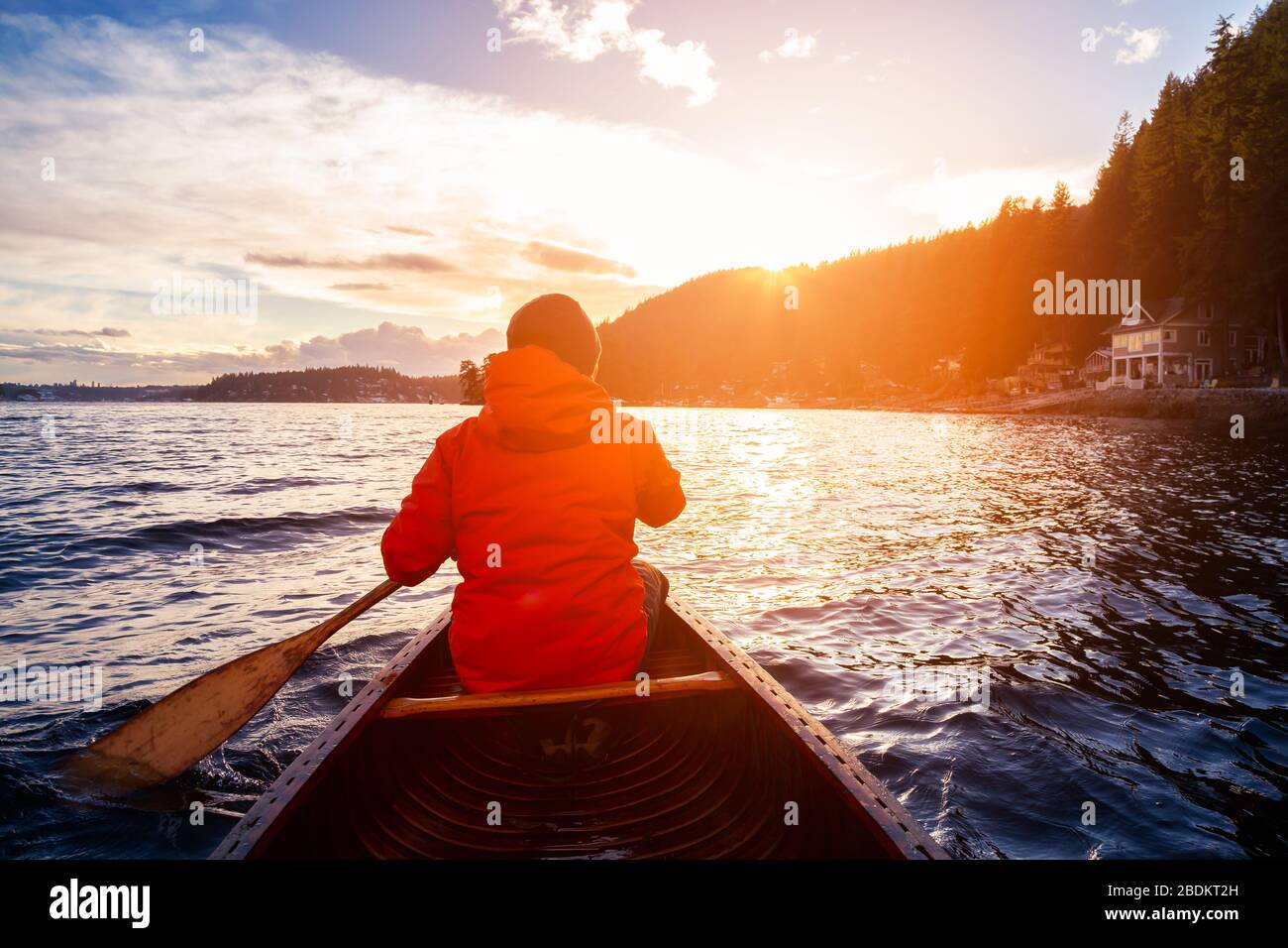 Canoeing during vibrant Sunset Stock Photo - Alamy