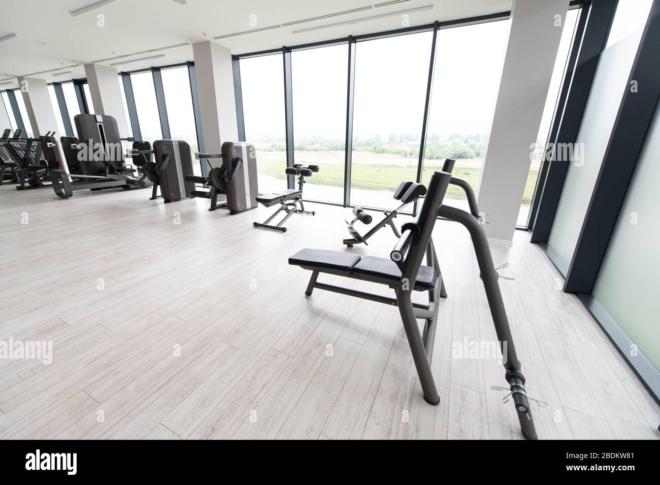 Modern Gym Room Fitness Center With Equipment And Machines Stock Photo ...