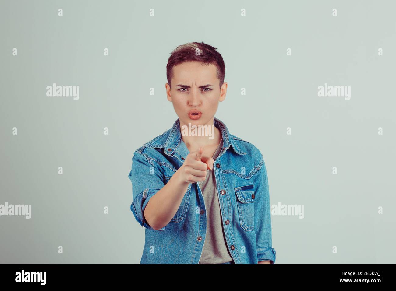 It's you! Angry annoyed boy alike style woman getting mad pointing ...