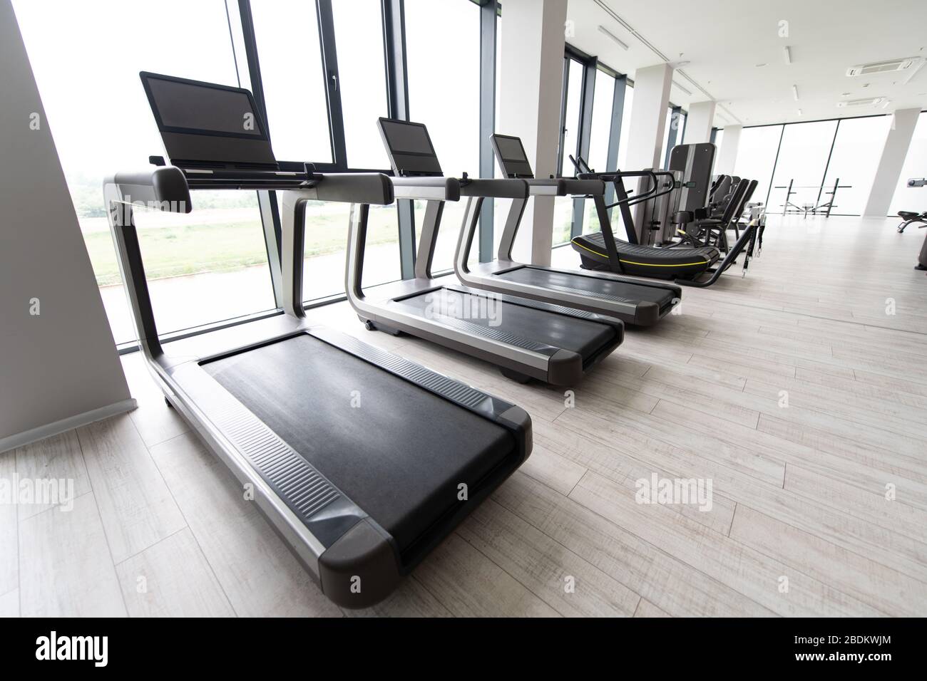 Modern Gym Room Fitness Center With Equipment And Machines Stock Photo ...