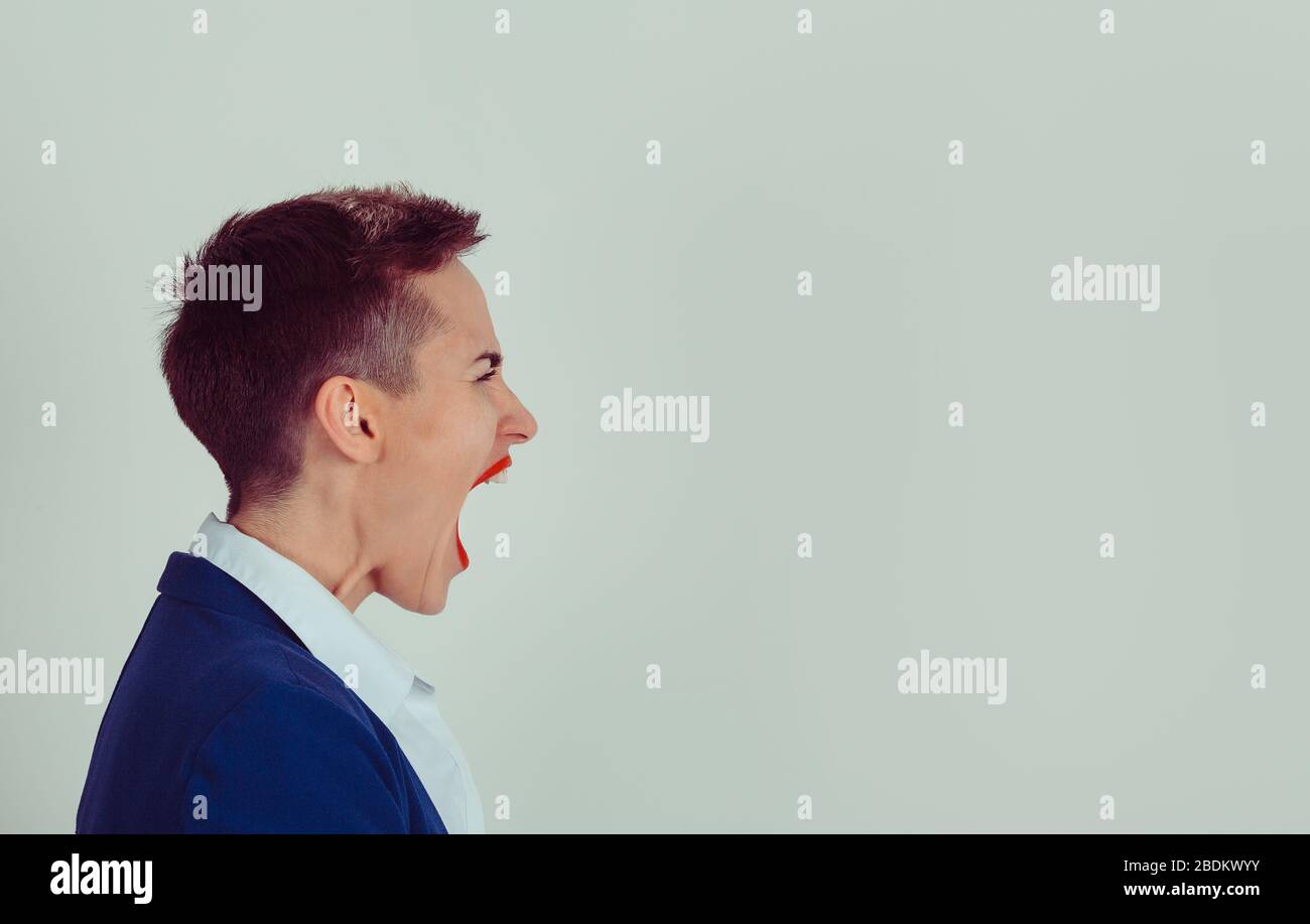 Angry woman screaming. Short hair girl, red lips navy blue suit white ...