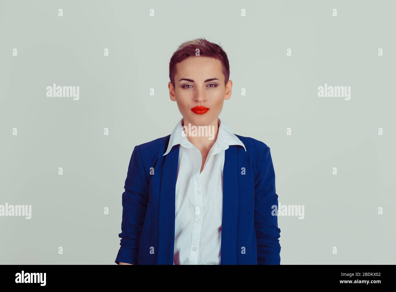 Confident serious business executive isolated bright green background ...
