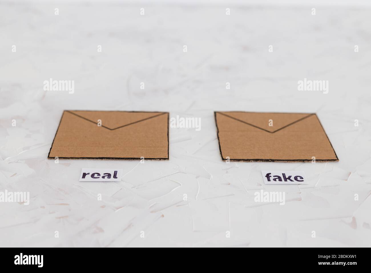 trust-wrothy vs fake emails or online scams concept, email envelop ...