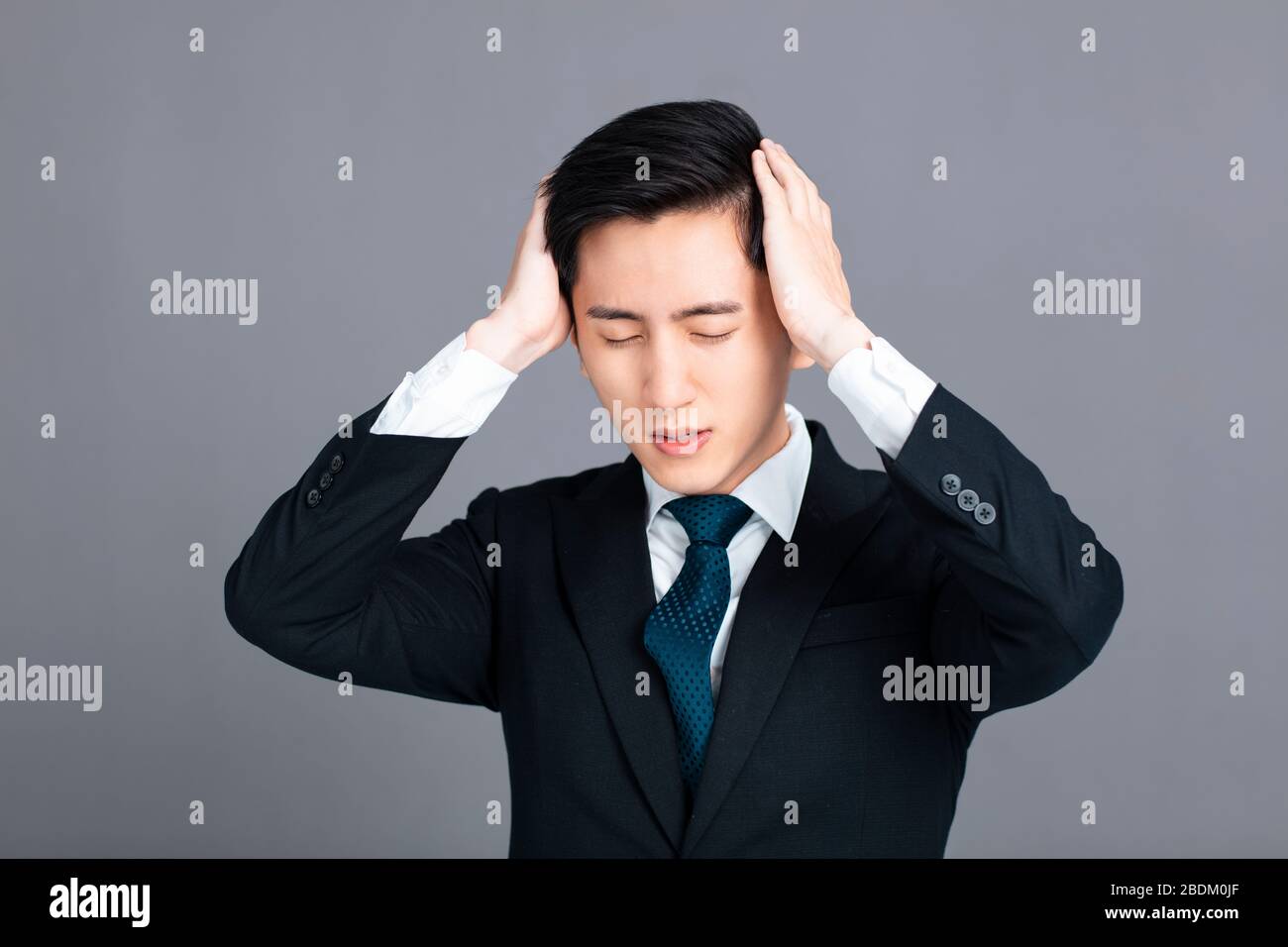 Face stressed young businessman thinking hi-res stock photography and ...