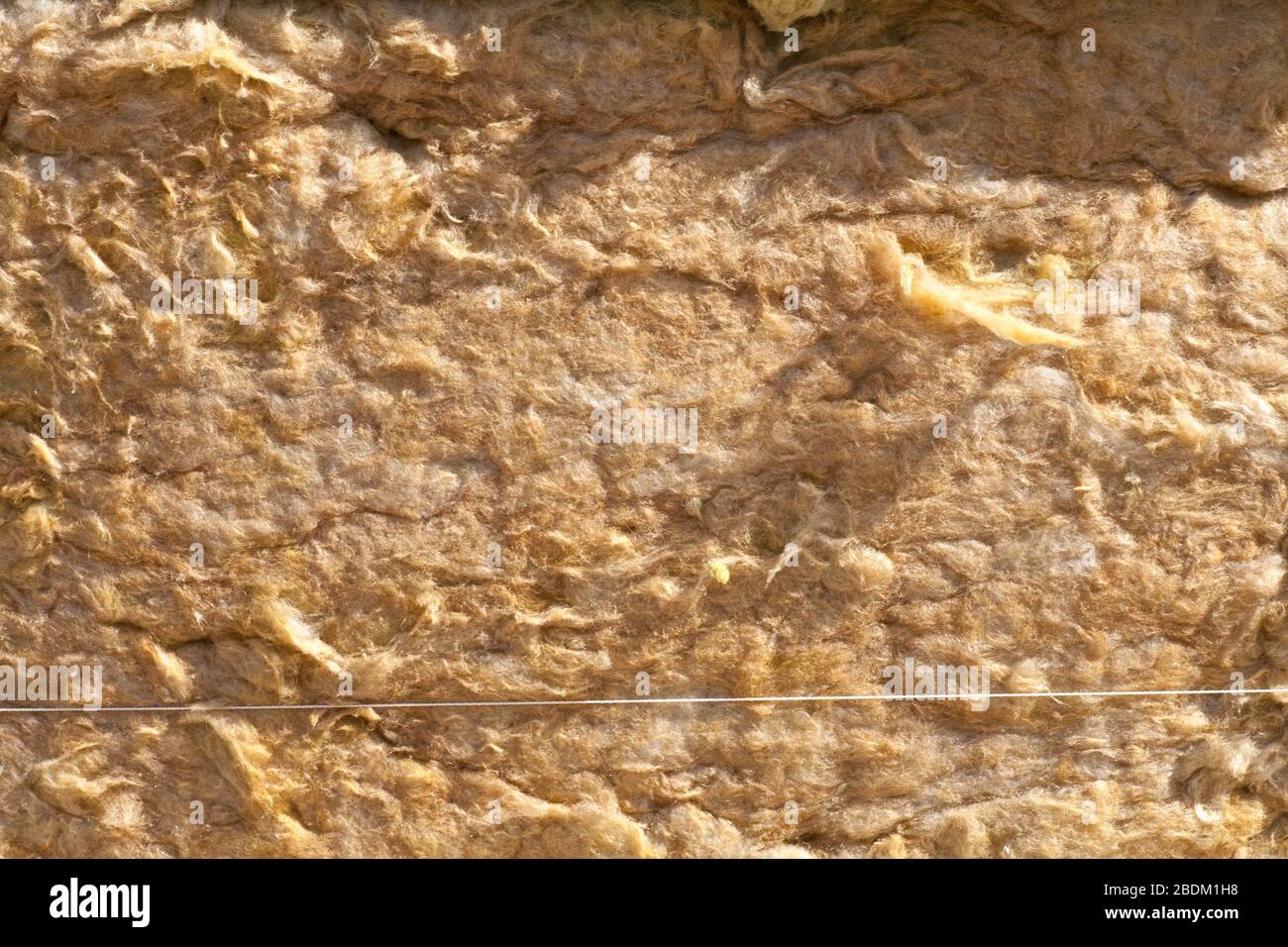 warming the walls of a stone house with a stone wool heater. Ecological ...