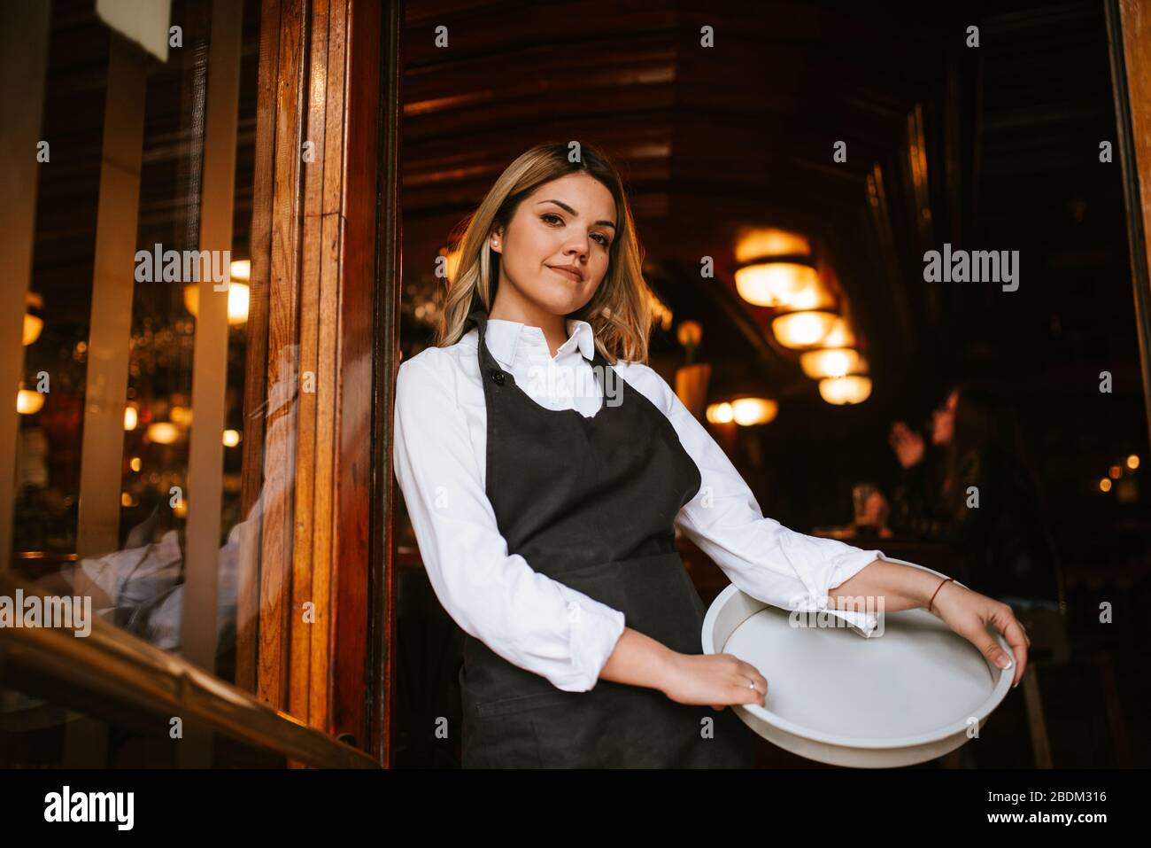 Waitress blonde attractive young woman hi-res stock photography and ...