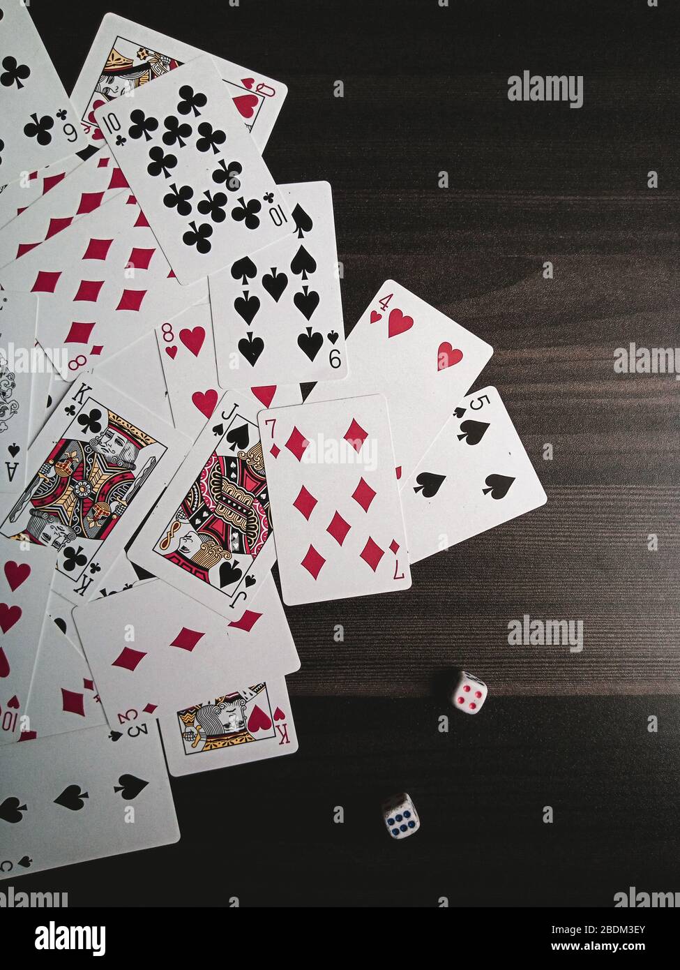 Playing cards in wooden table black and white enjoy your game Stock ...