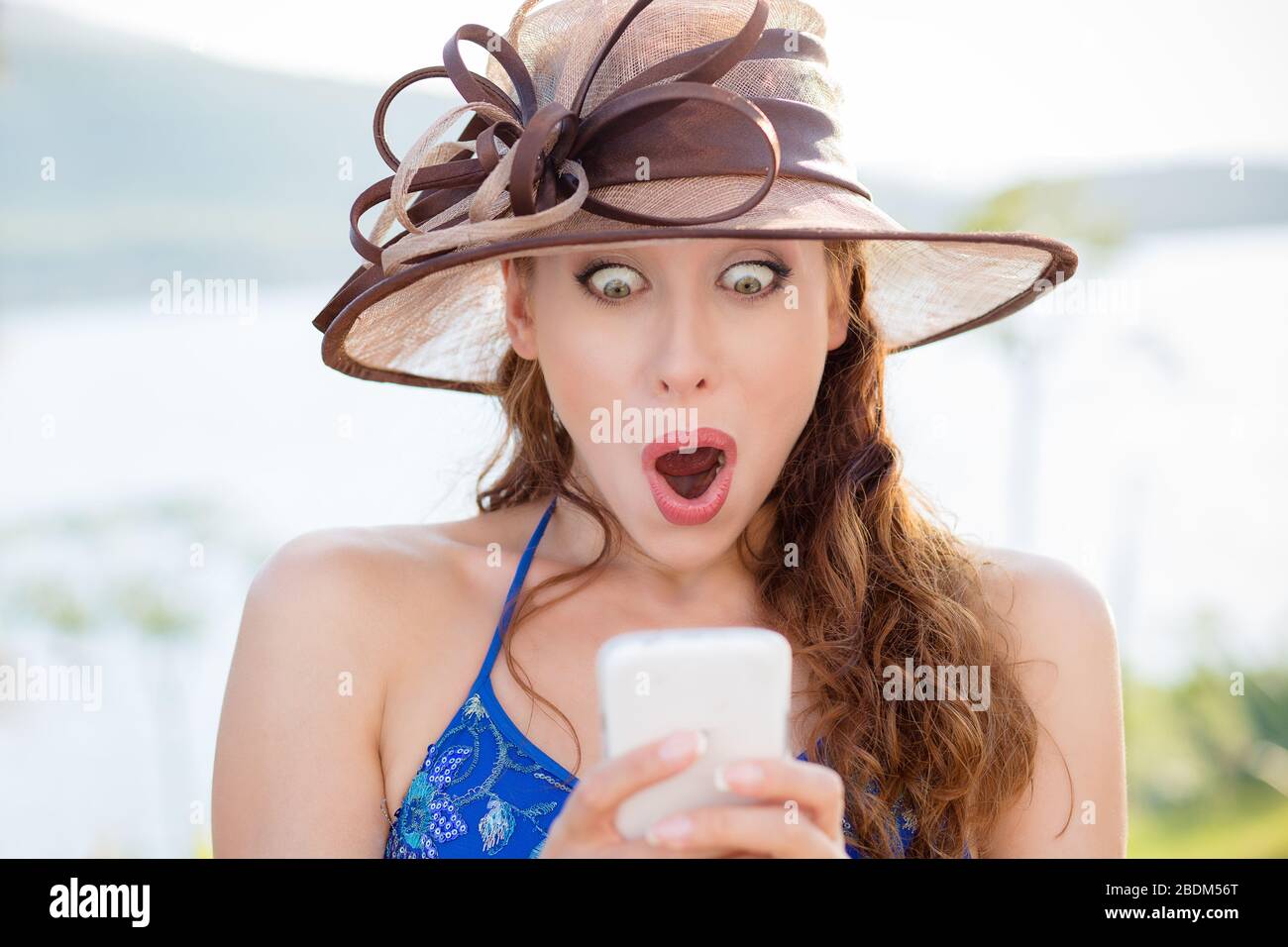 SMS. Closeup portrait funny shocked anxious scared young girl looking ... SMS. Closeup portrait funny shocked anxious scared young girl looking ...