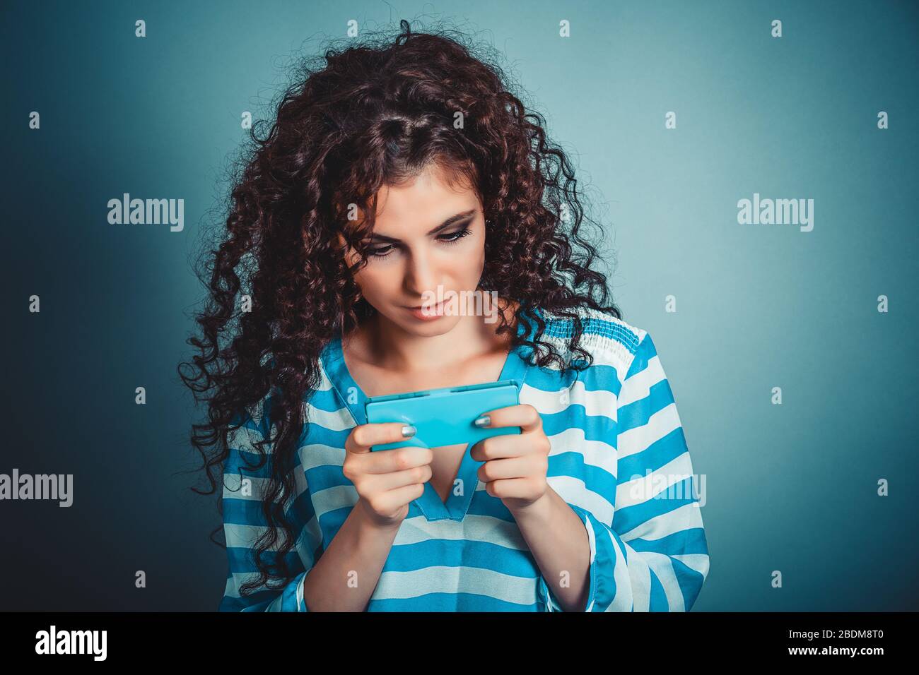 Serious woman texting. Closeup portrait headshot stressed woman holding ...