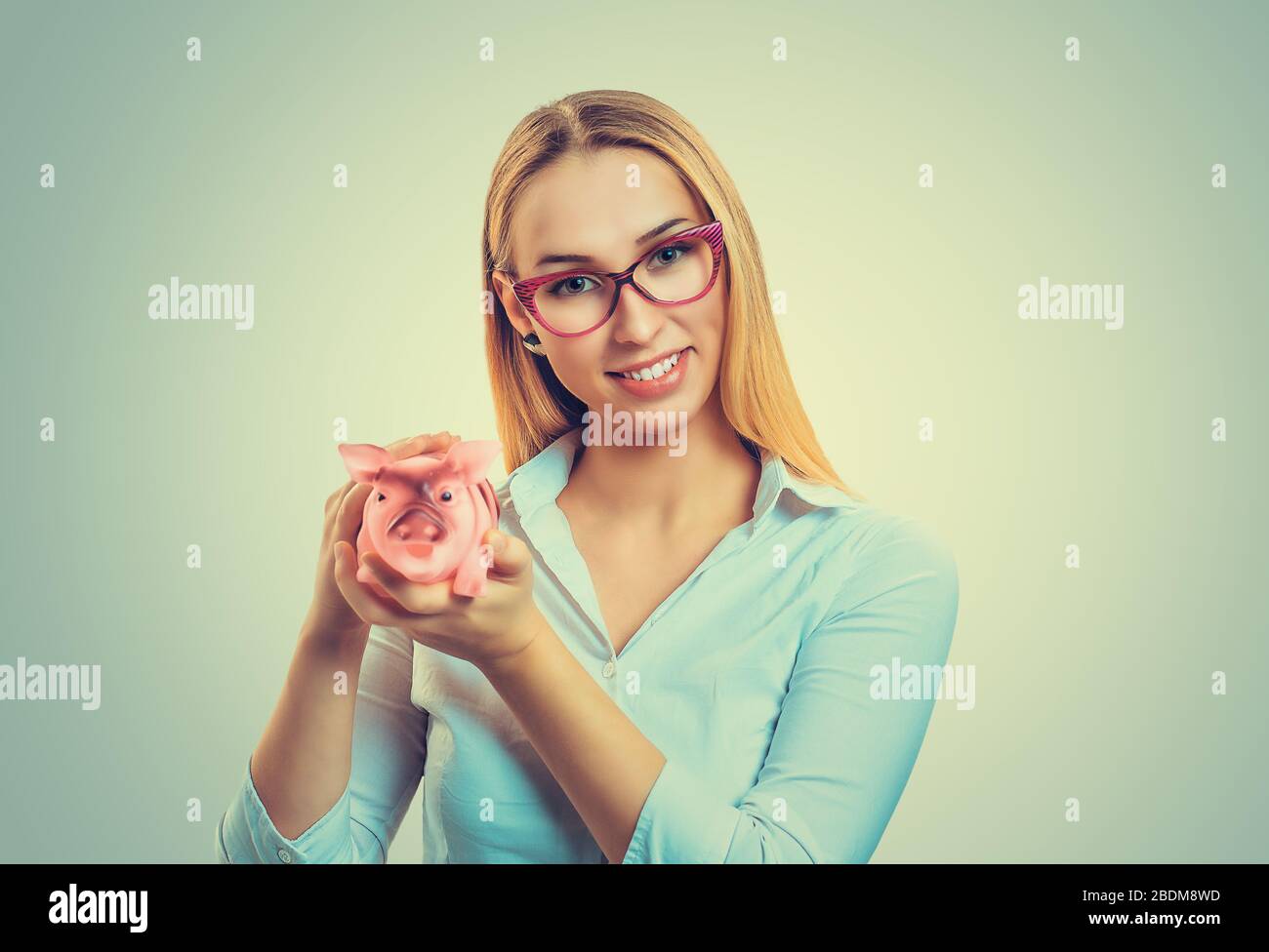 Savings. Closeup portrait glad happy smiling young business woman ... Savings. Closeup portrait glad happy smiling young business woman ...