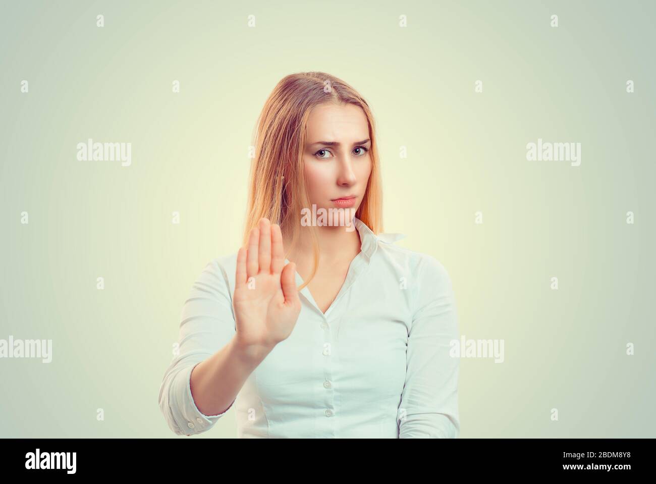 Closeup portrait young angry serious woman showing her denial No Stop ...
