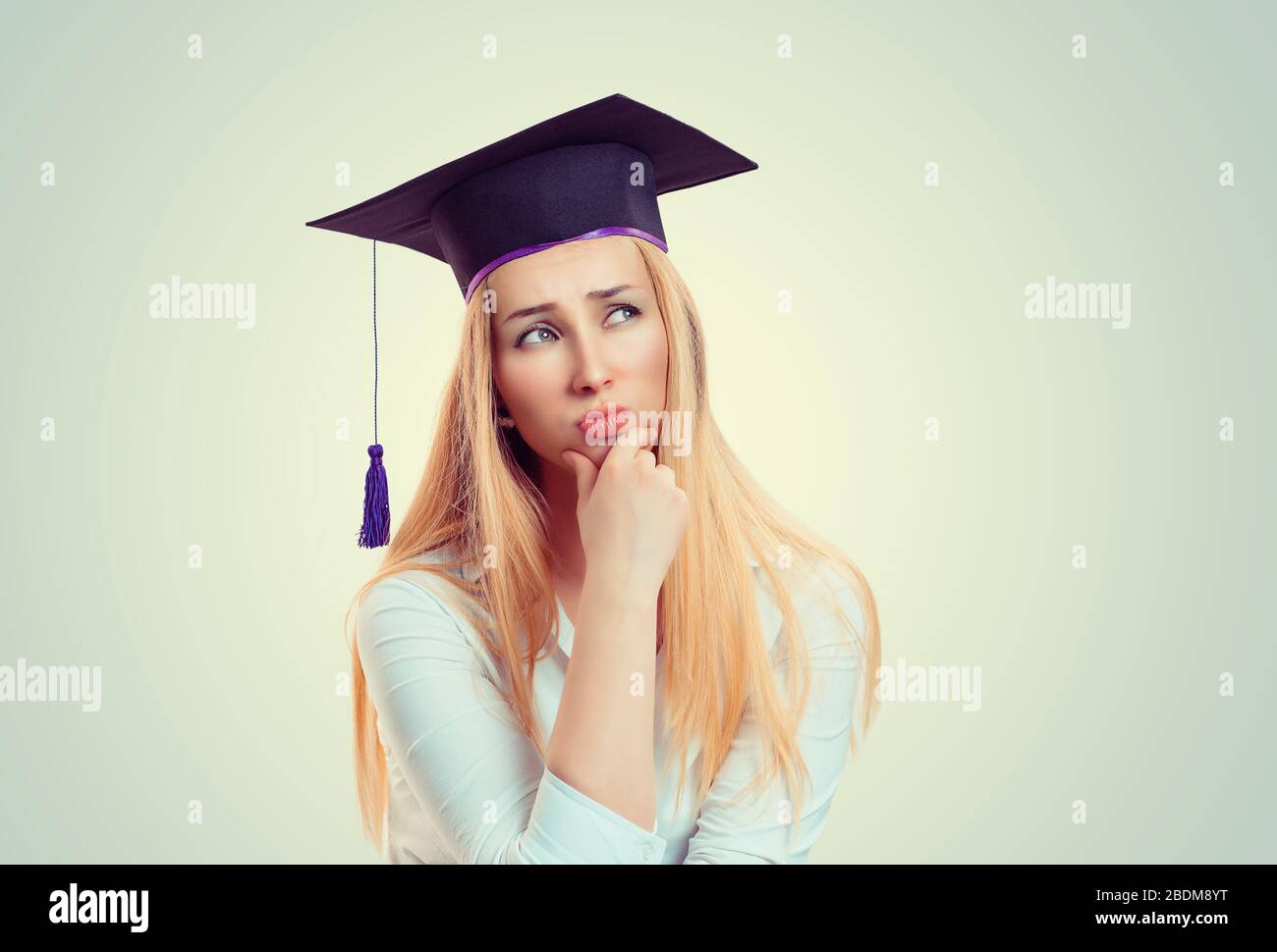 Portrait closeup young beautiful thoughtful graduate graduated student ...