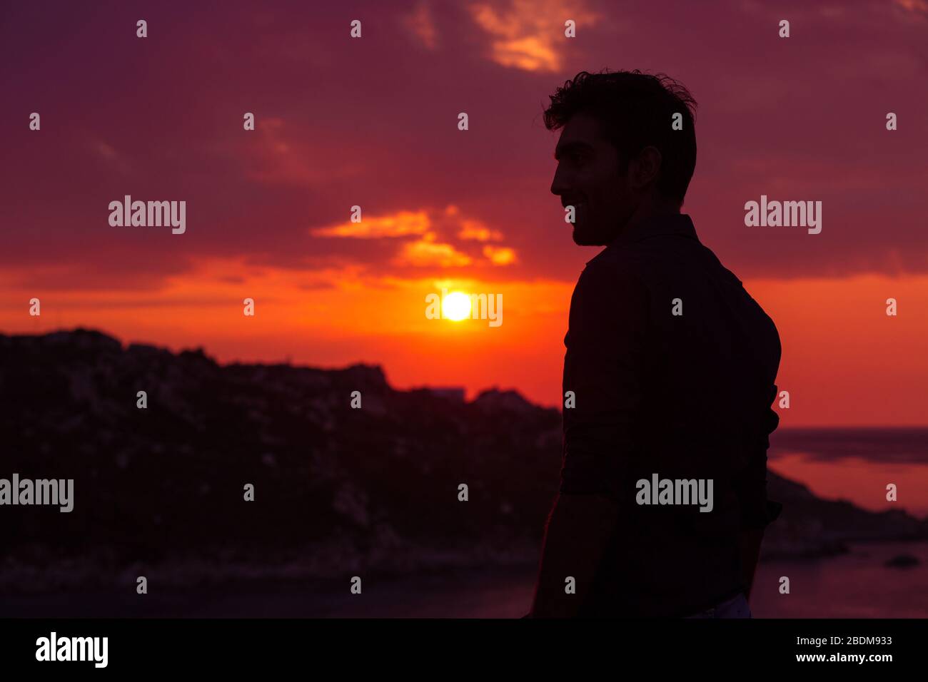 man standing thinking back light sunset lighting side view summer ...