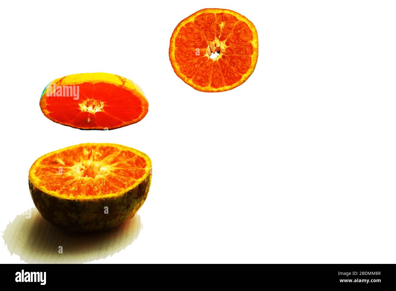 An orange fruit divided into three pieces Stock Photo - Alamy