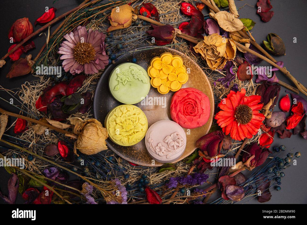 Moon cake with dried flower close-up Stock Photo - Alamy