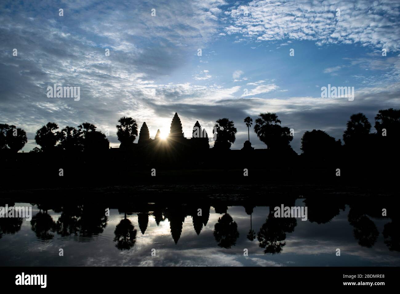 Sunrise over Angkor Wat with lake reflection Stock Photo - Alamy