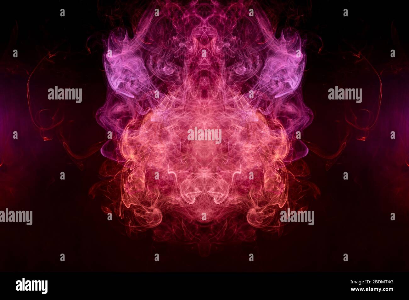 Smoke of pattern pink and red in the form of horror monster on a dark ...