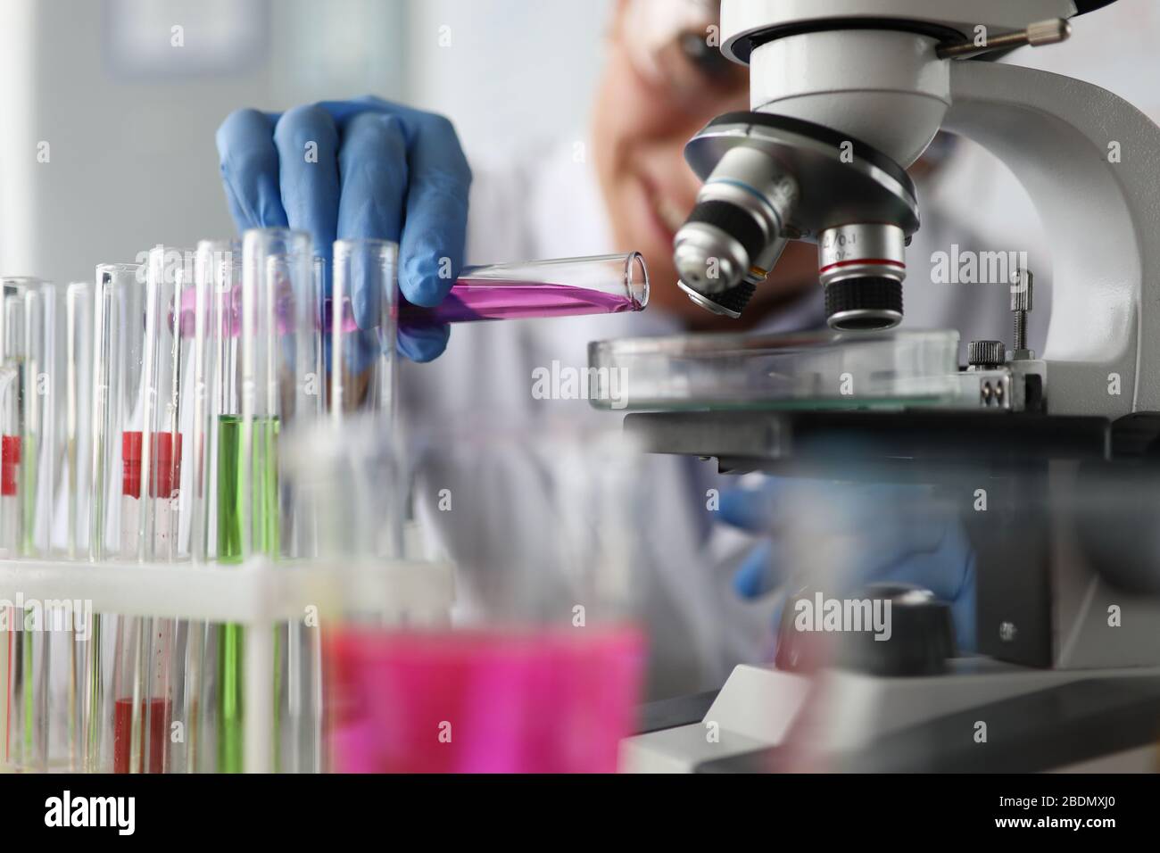 Scientist holding test tube hi-res stock photography and images - Alamy